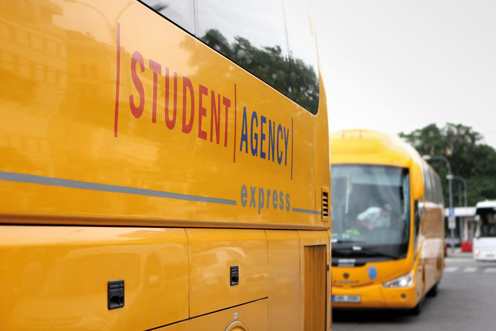 REGIOJET logo, yellow trains and buses | Omega Design